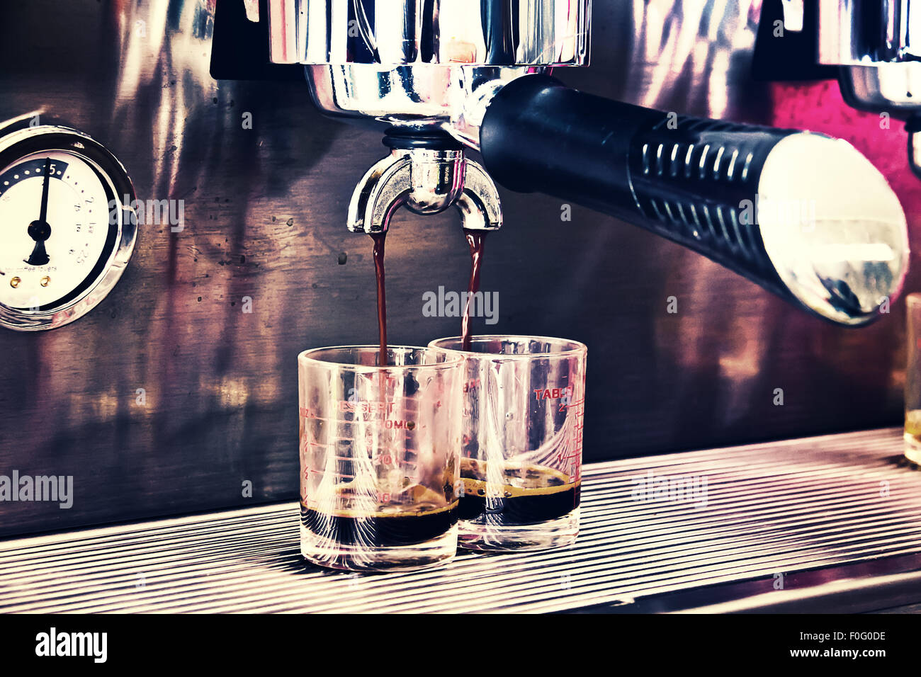 Process of preparation of coffee, a closeup.coffee machine in a cafe ...
