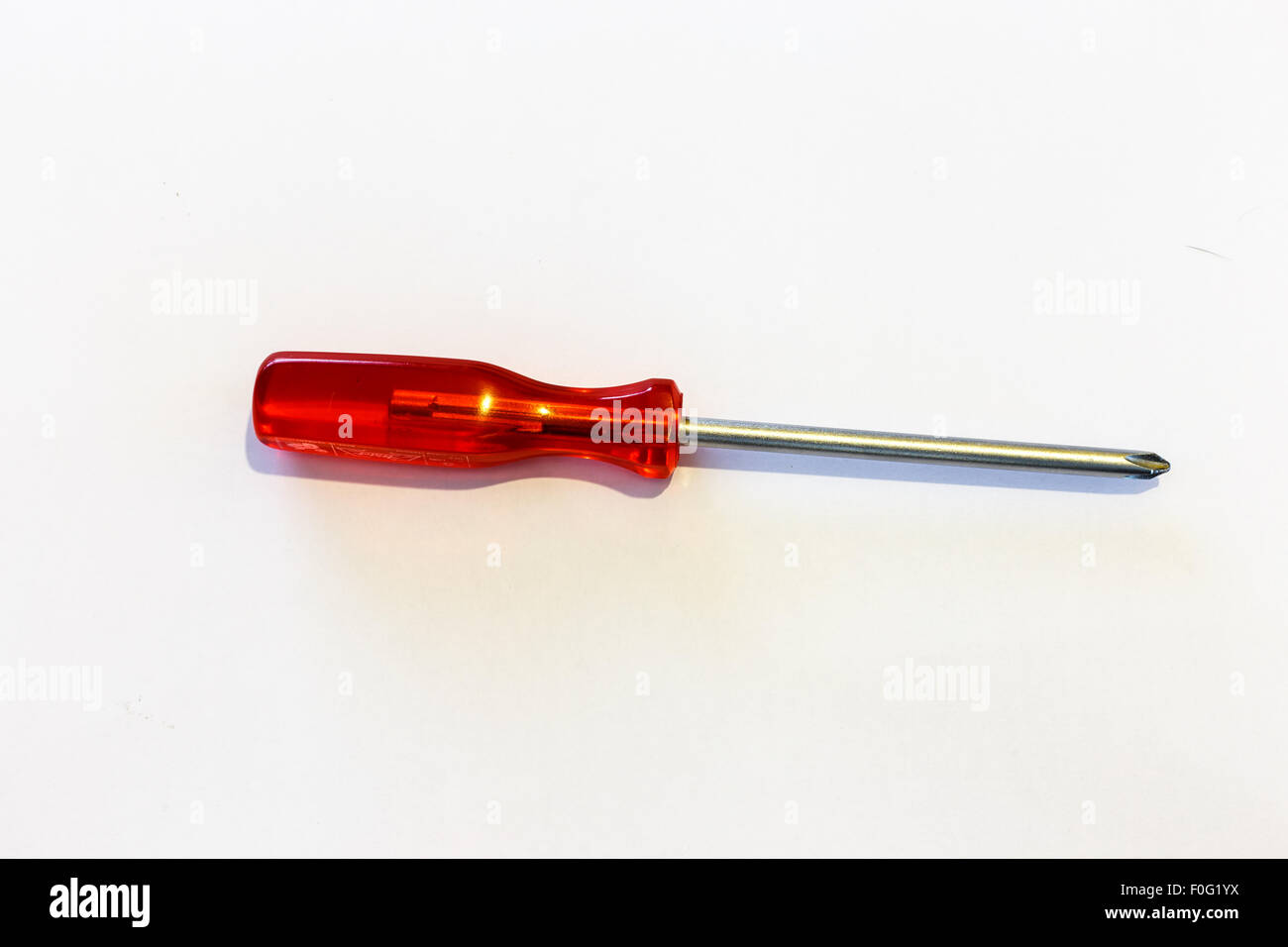 red screwdriver isolated on white Stock Photo - Alamy