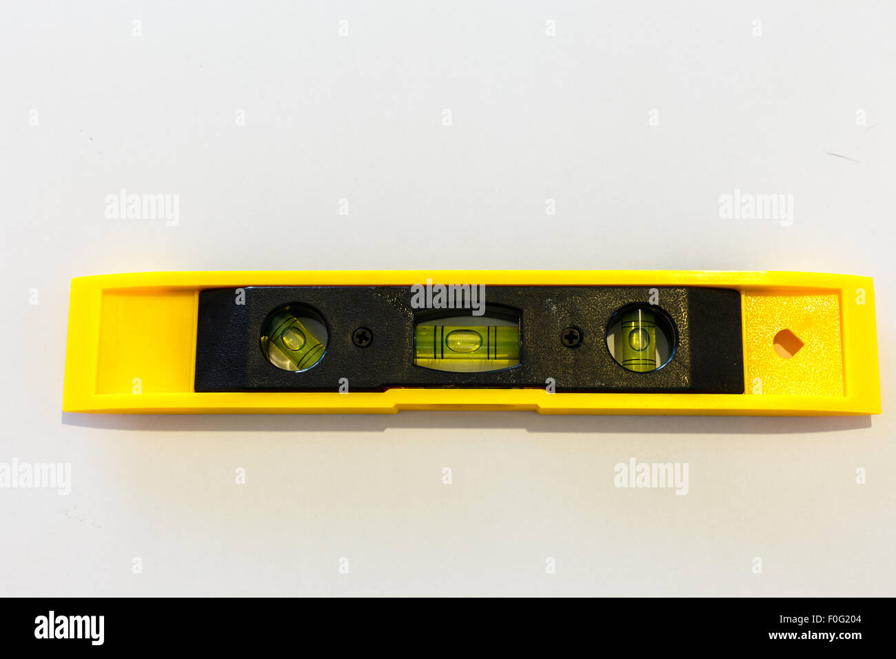 Yellow spirit level isolated on white background Stock Photo - Alamy