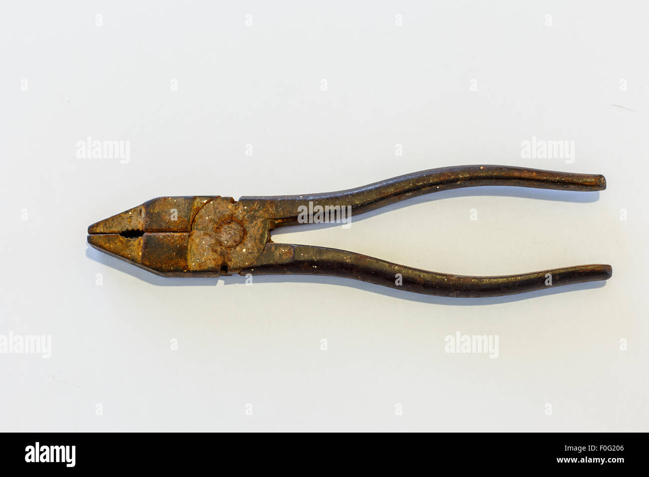 old used black linemans or combination pliers isolated on white ...