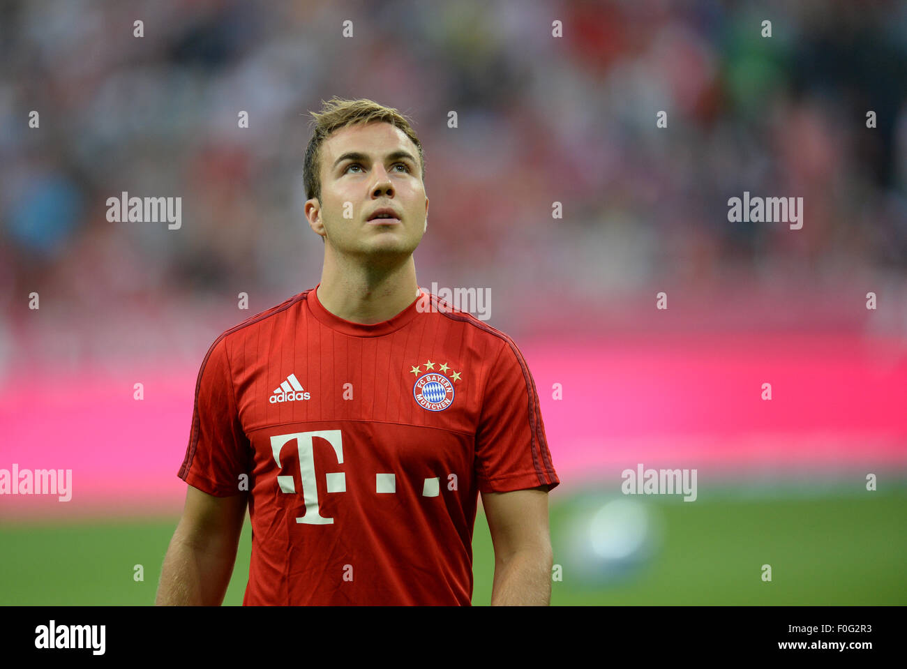 Munich, Germany. 14th Aug, 2015. Munich's Mario Goetze walks across the ...