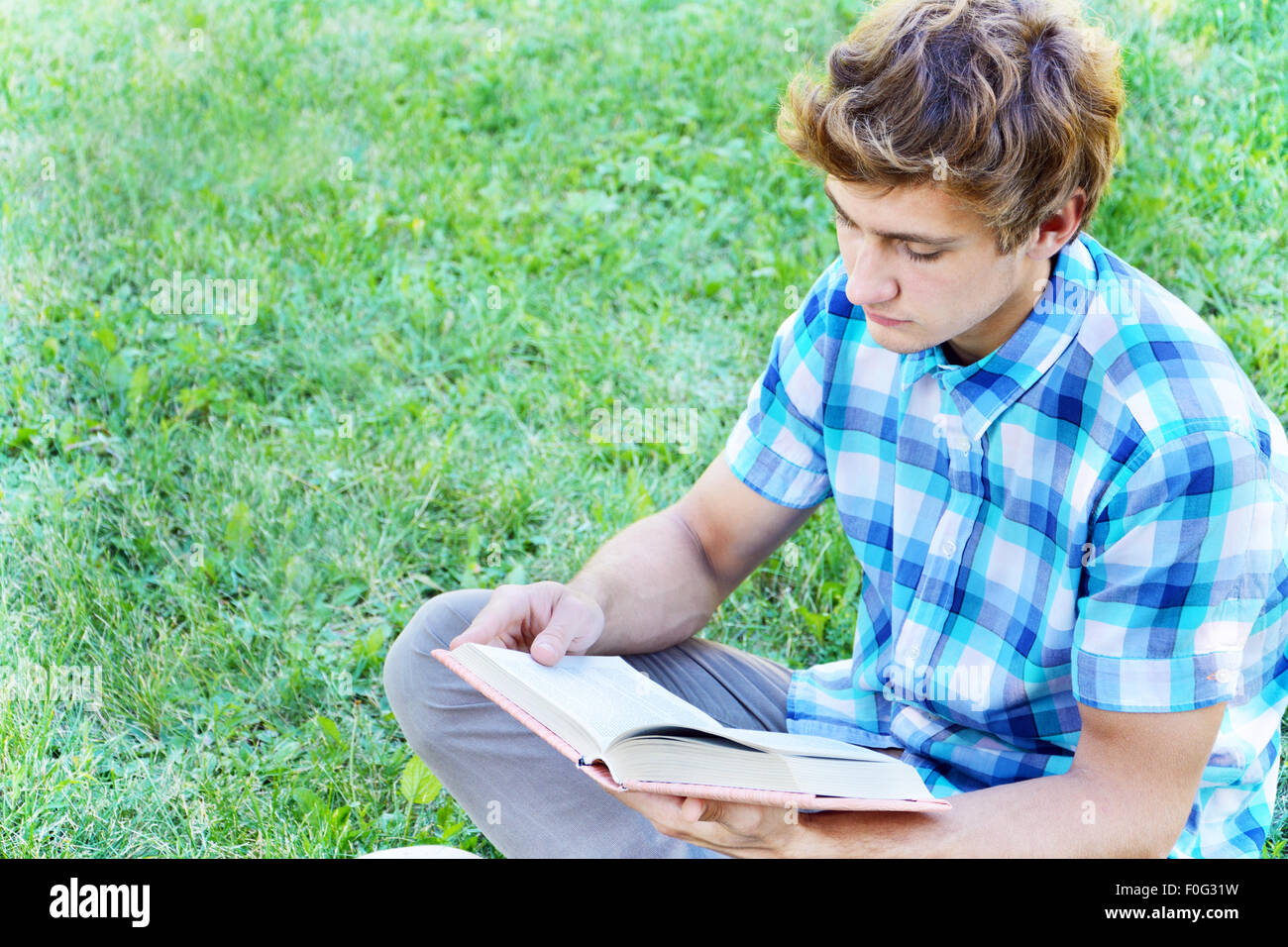 Adult male reading book hi-res stock photography and images - Alamy