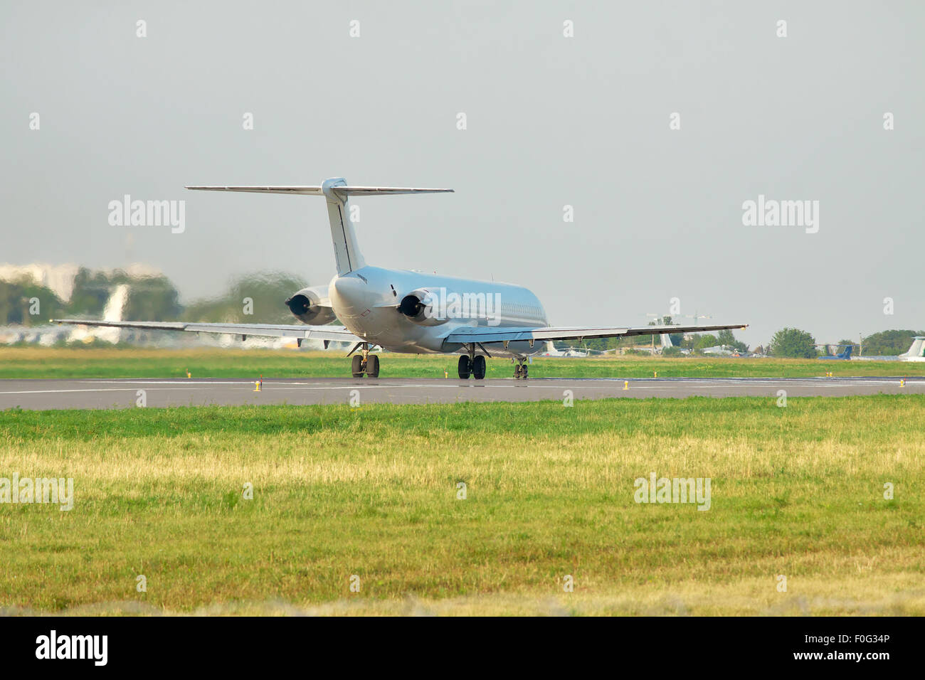 Passenger jet plane taking off from the runway in the airport Stock ...
