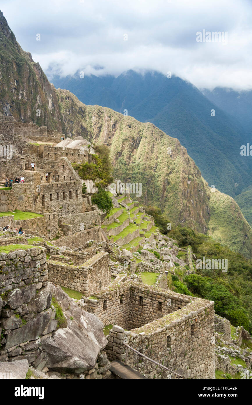Ancient architecture and ruins of the famous Inca city at Machu Picchu ...