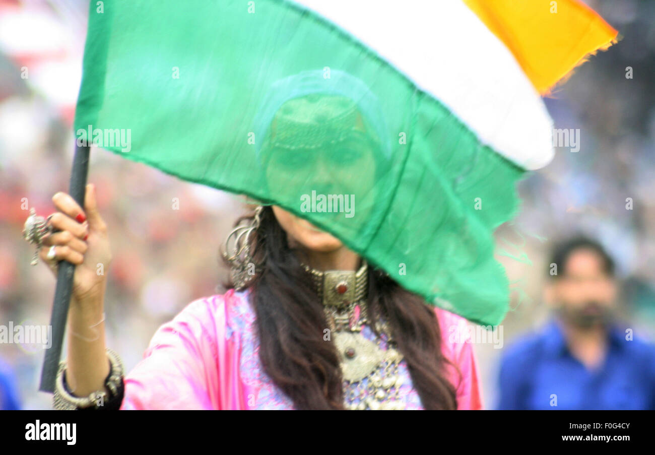 Srinagar, Indian Administered Kashmir:15 August. ASchool student in traditional Kashmiri attire ...