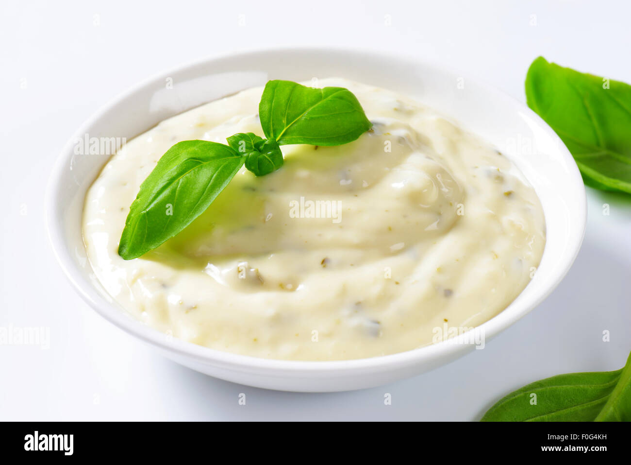 Creamy salad dressing made of mayonnaise, buttermilk, garlic, herbs ...