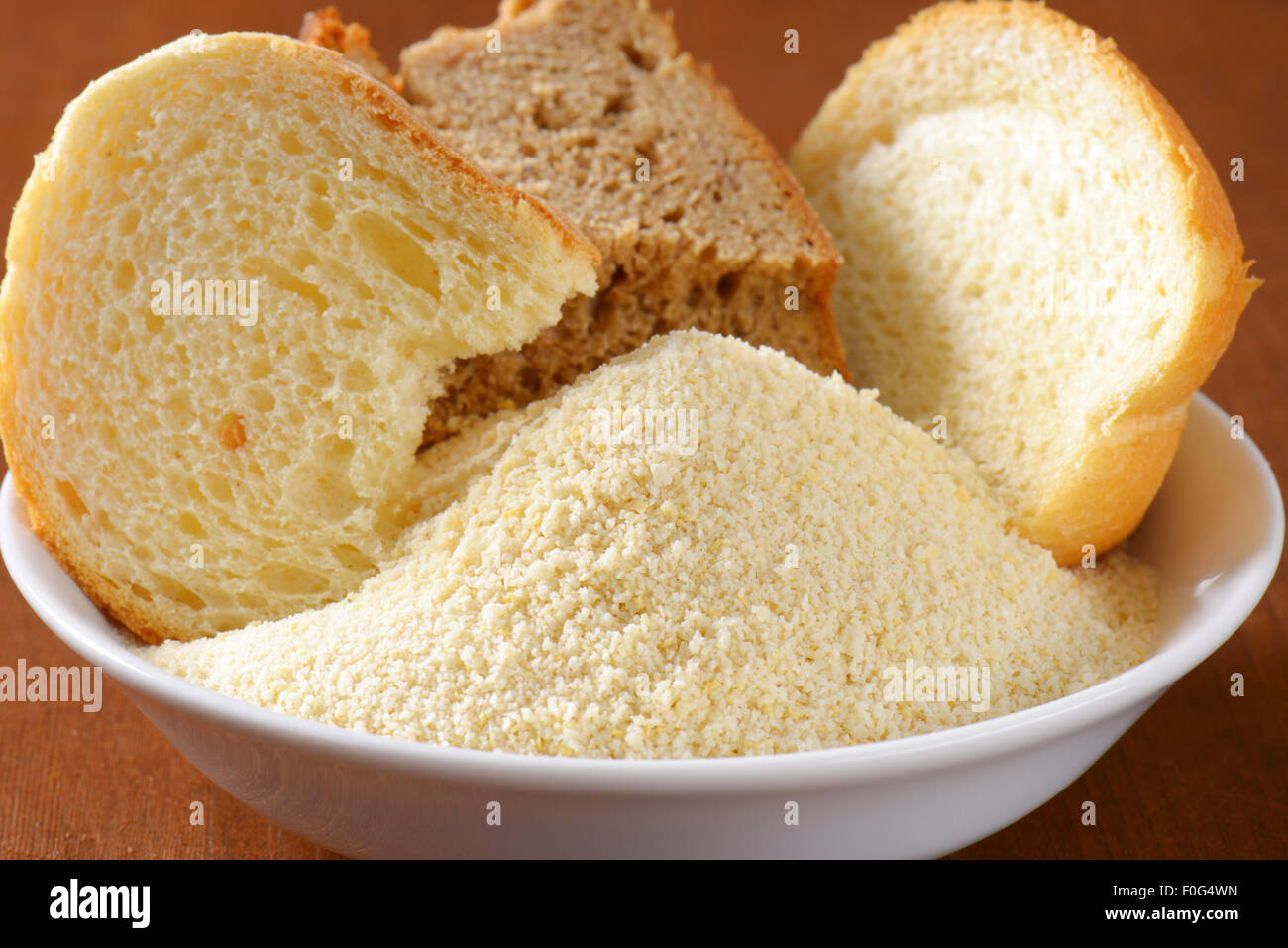 Pieces of stale bread and pile of finely ground bread crumbs Stock ...