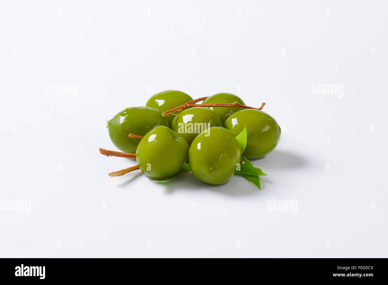 Fresh green olives on white background Stock Photo - Alamy