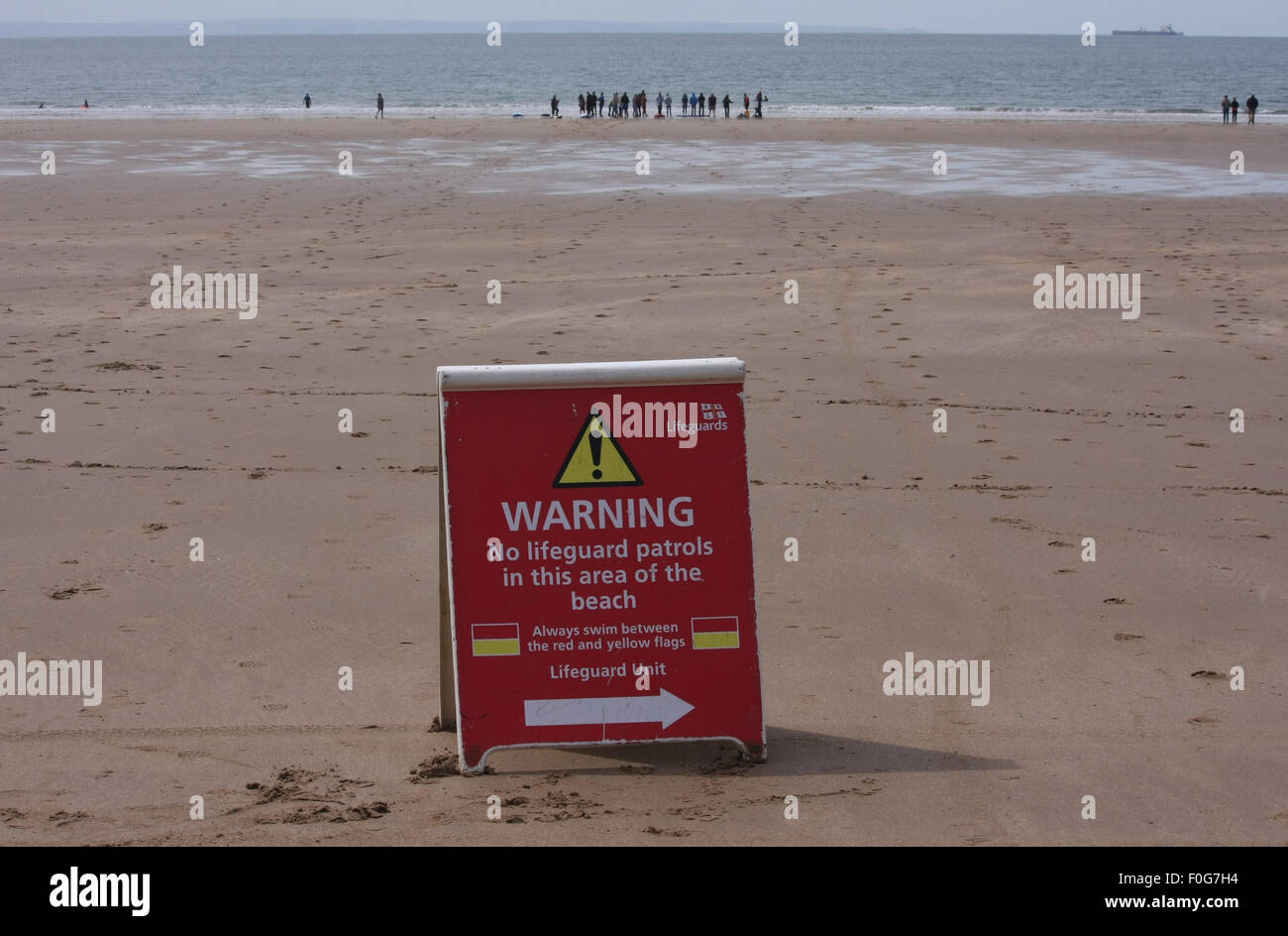 Warning sign on beach Stock Photo - Alamy