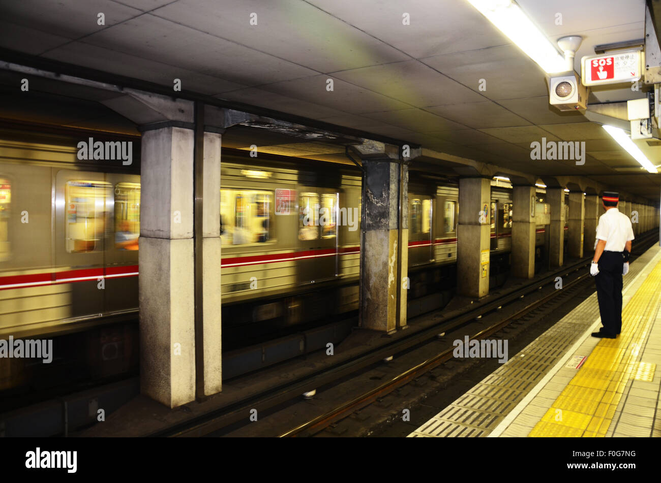Japanese station master working at Subway train Numba station on July 8 ...