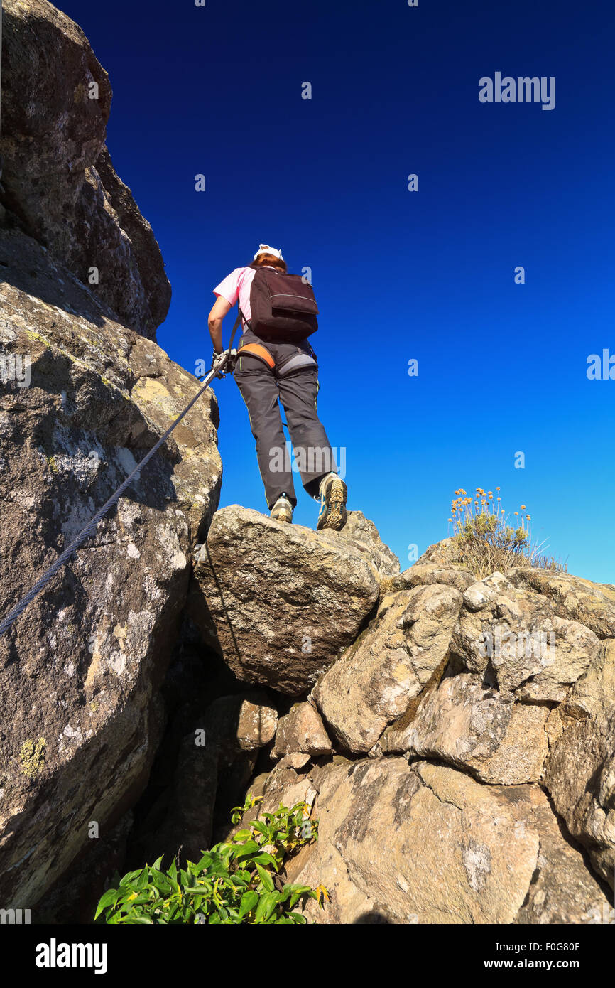 woman on via Ferrata in Capanne mount, Elba island, Italy Stock Photo ...