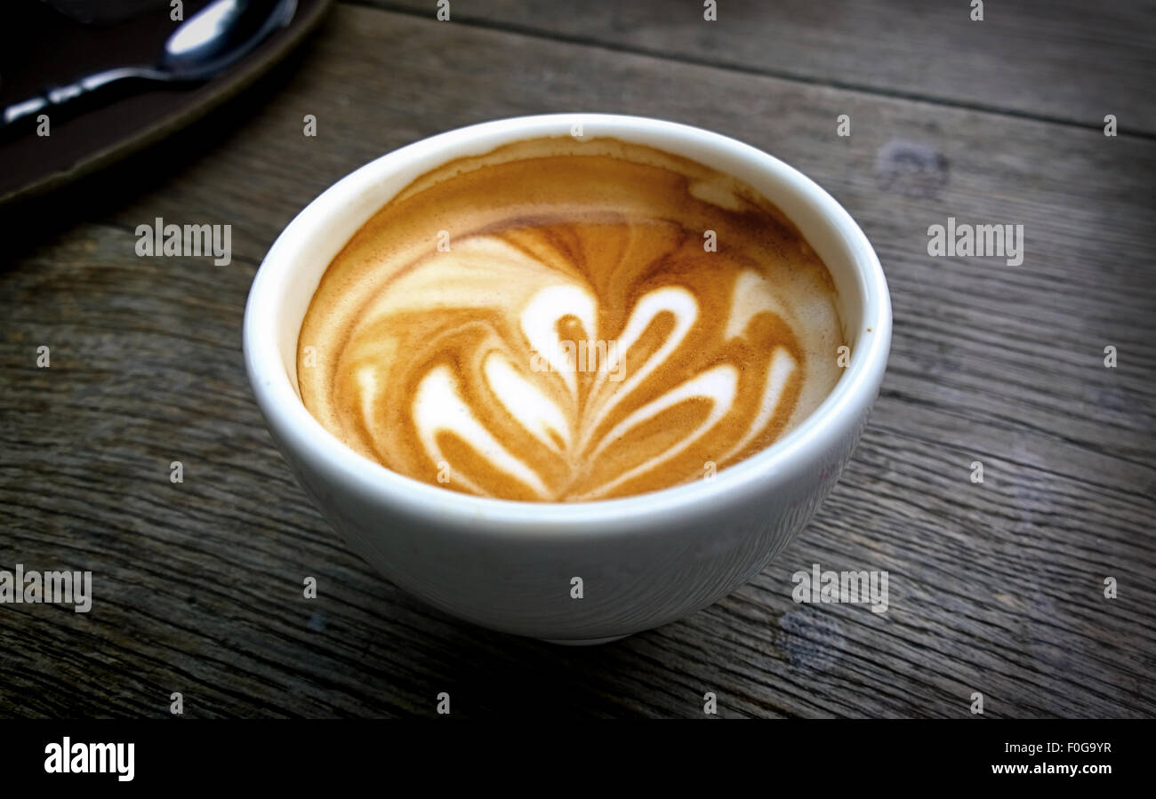 cup of cappuccino with foam on grunge wooden background Stock Photo - Alamy