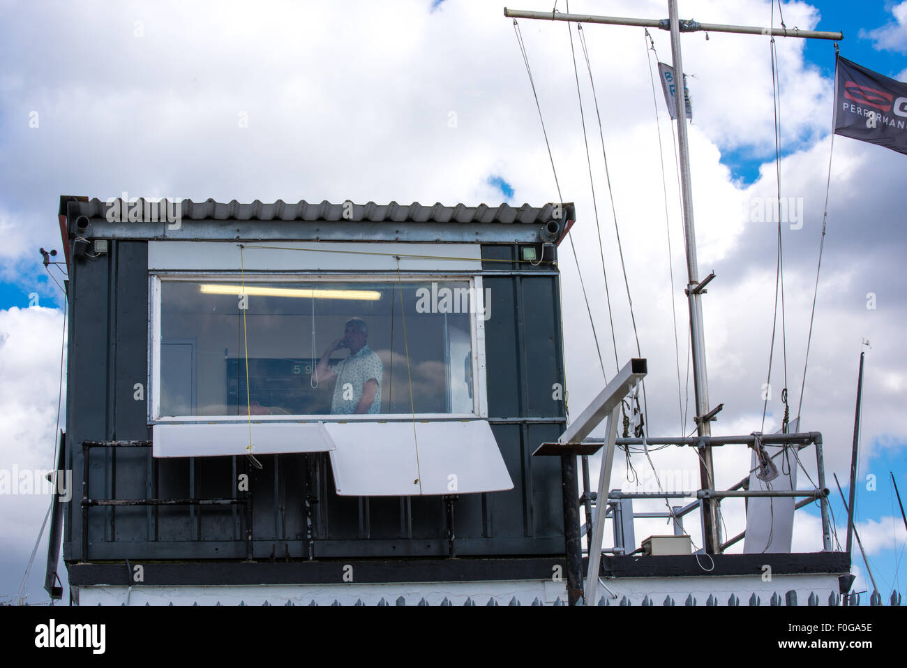 A man in the window on a phone at the sailing club Chasewater Country ...