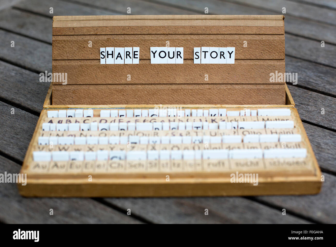 the words "share your story" on an old school letter box Stock Photo ...
