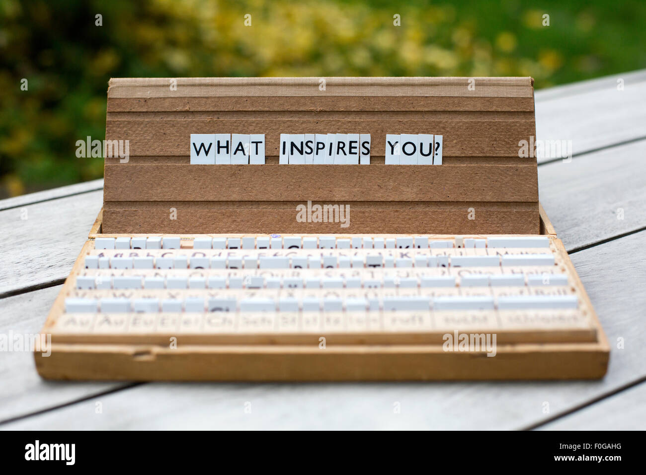 the words "what inspires you?" on an old school letter box Stock Photo ...