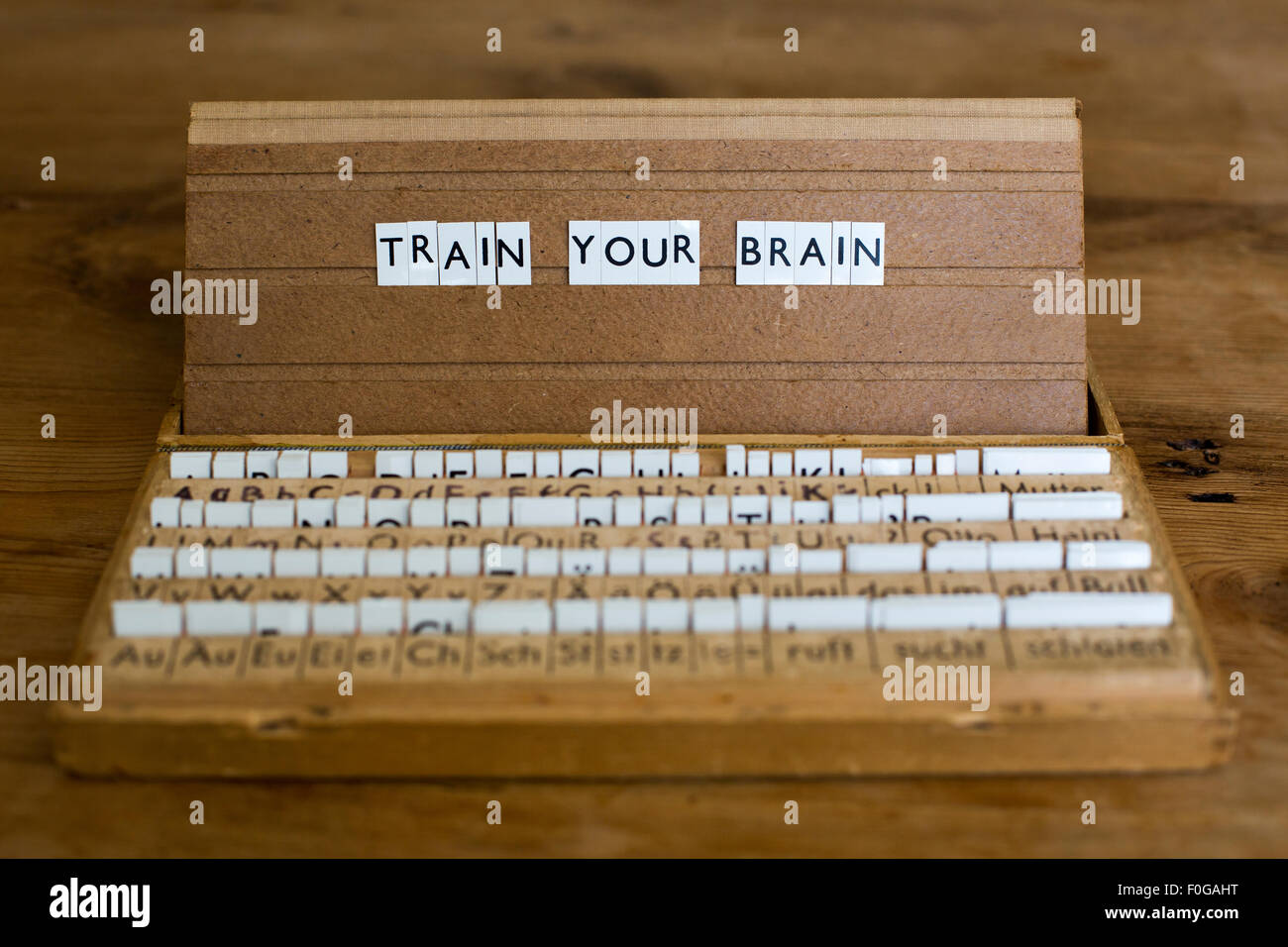 the words "train your brain" on an old school letter box Stock Photo ...