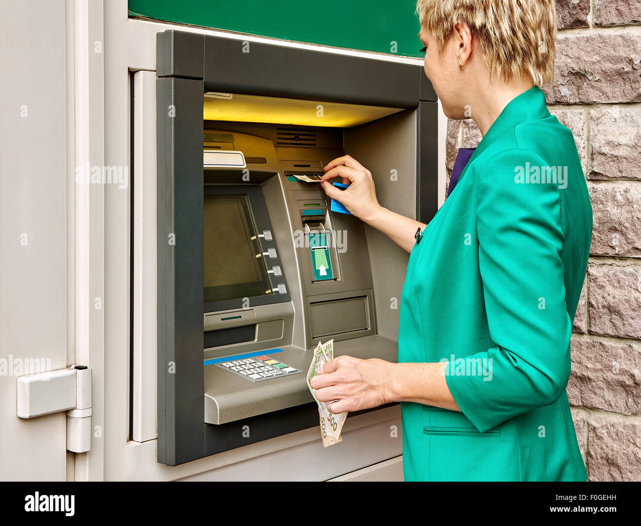 Business woman at atm hi-res stock photography and images - Alamy