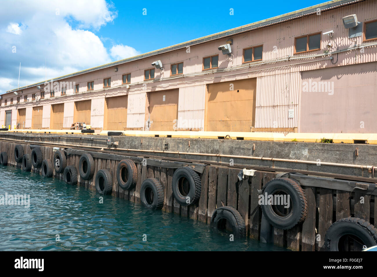An empty supply dock in a harbor waiting to host an incoming vessel ...