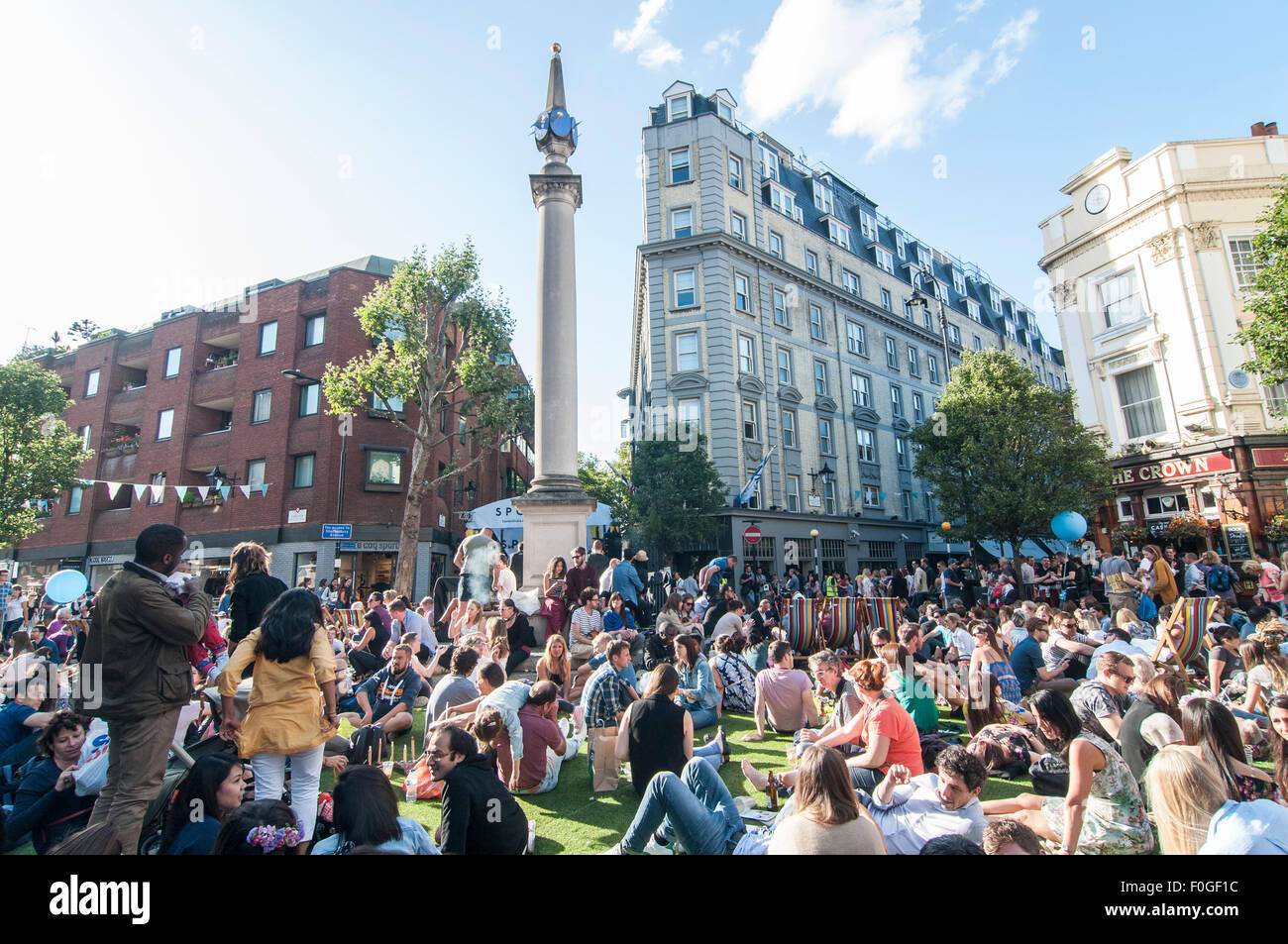 London, UK. 15 August 2015. Large crowds gather in the sunshine to ...