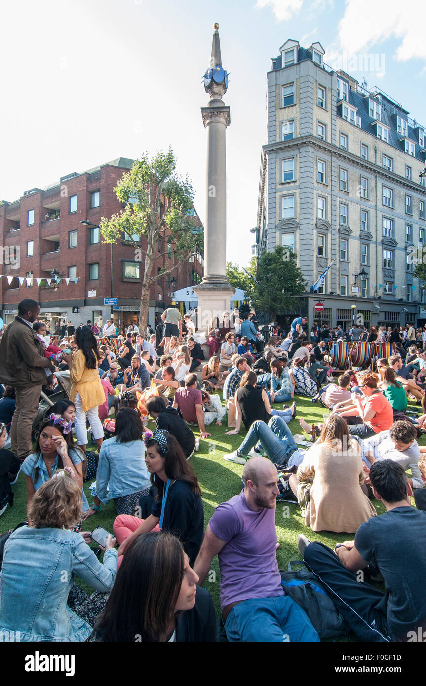 London, UK. 15 August 2015. Large crowds gather in the sunshine to ...