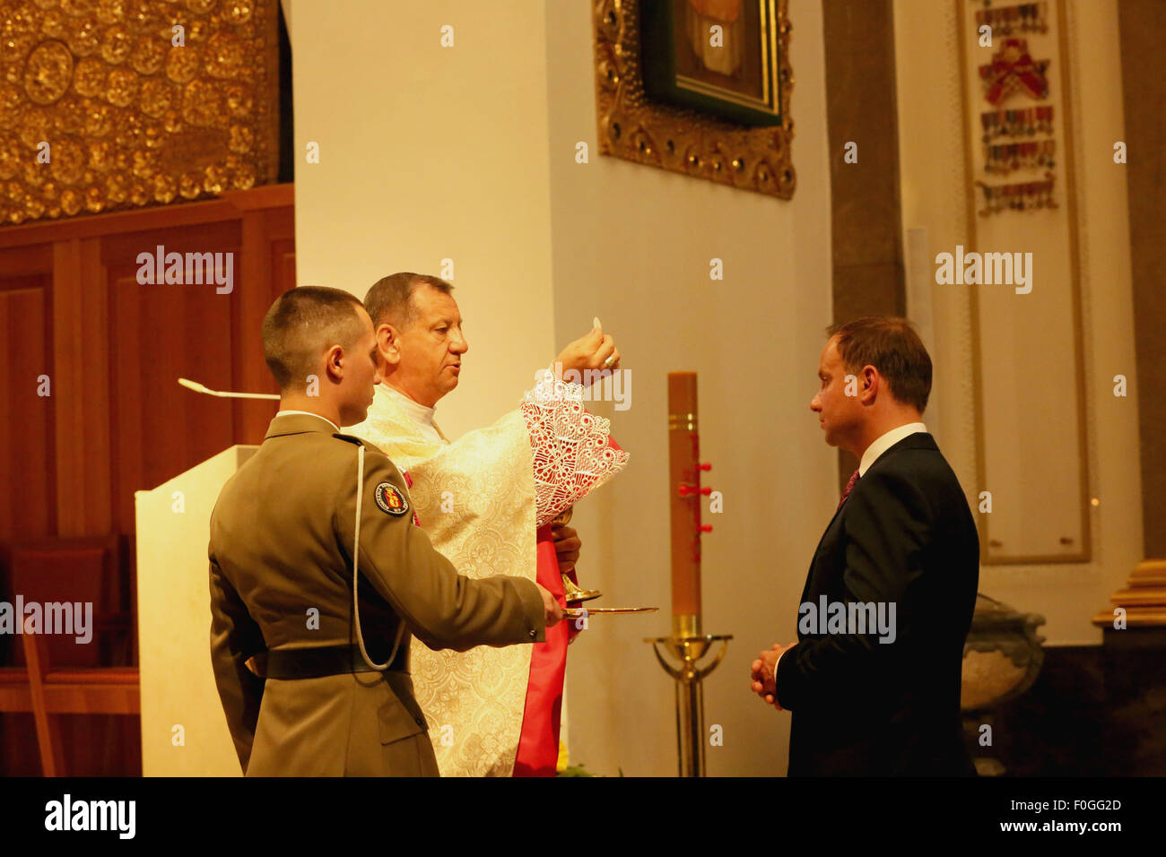 Polish President, Andrzej Duda, receives Holy Communion during a mass ...