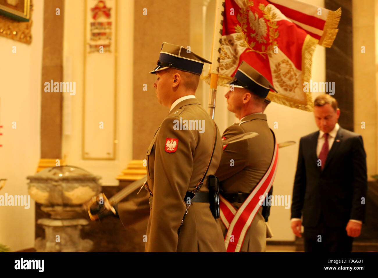 Polish President, Andrzej Duda, salutes the Polish Army flag, during a ...