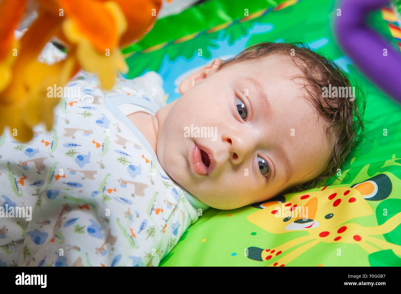 Baby boy on playmat hi-res stock photography and images - Alamy