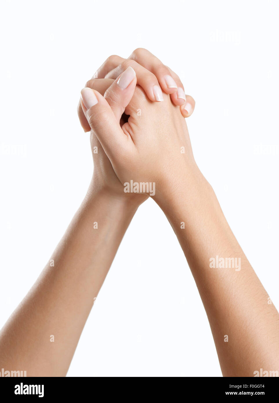 Woman hands folded in front of white background, isolated Stock Photo ...