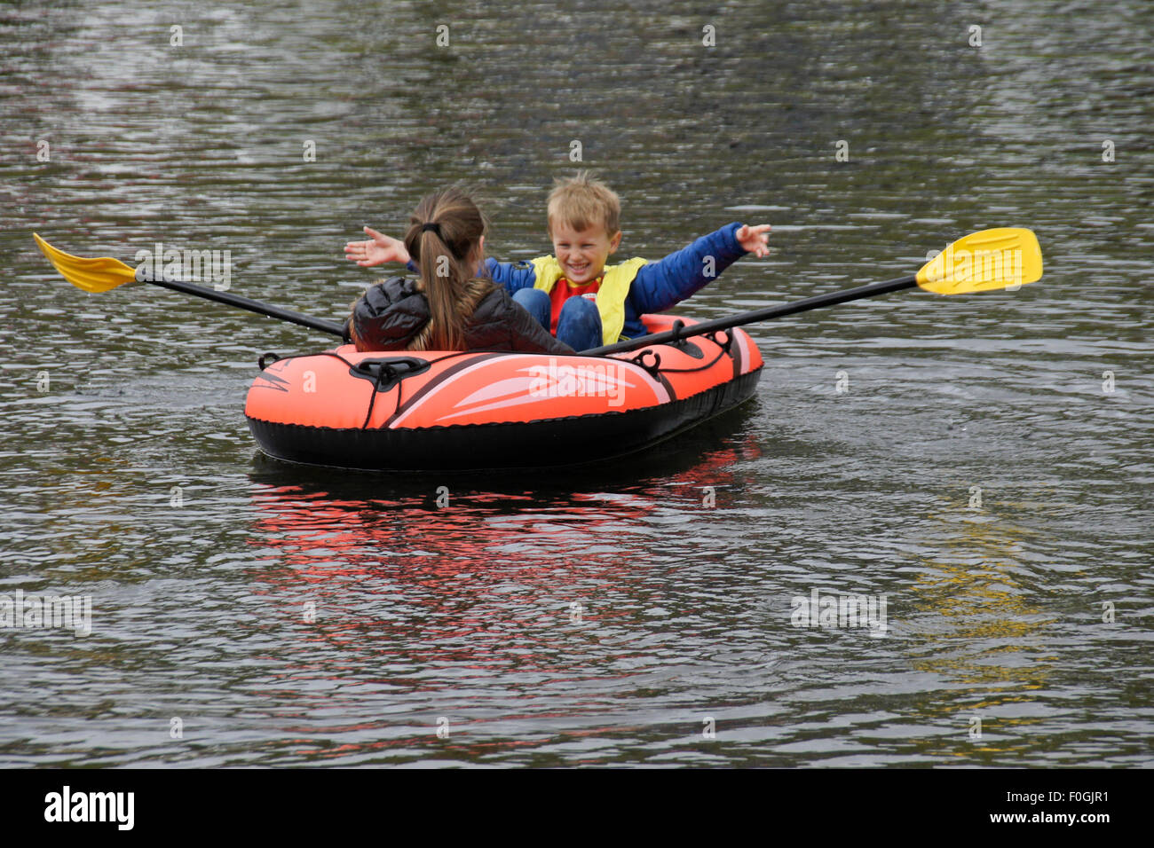 Kids playing in raft, village of Sandavagur, Vagar Island, Faroe ...