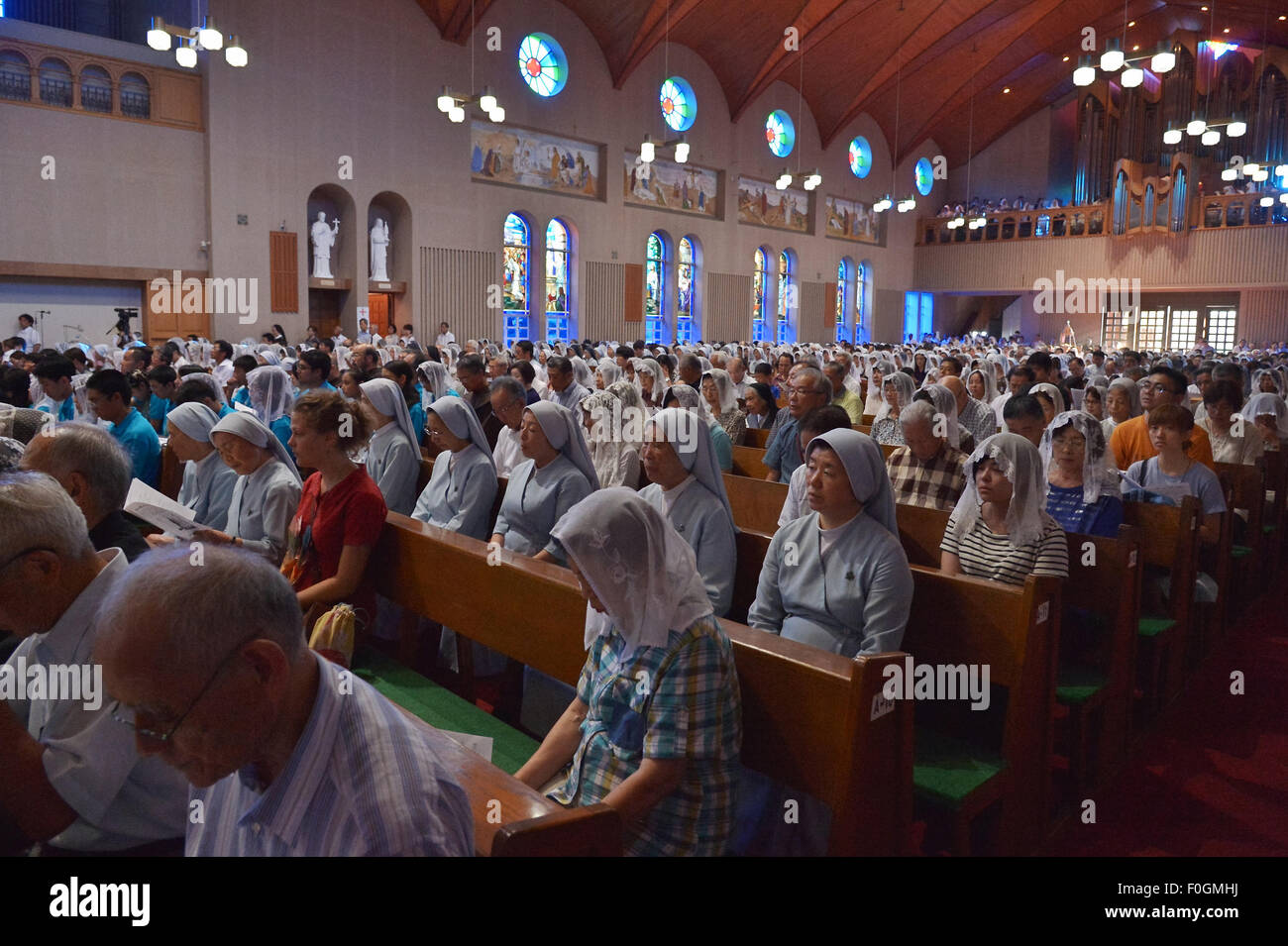 Worshippers pray during mass hi-res stock photography and images - Alamy