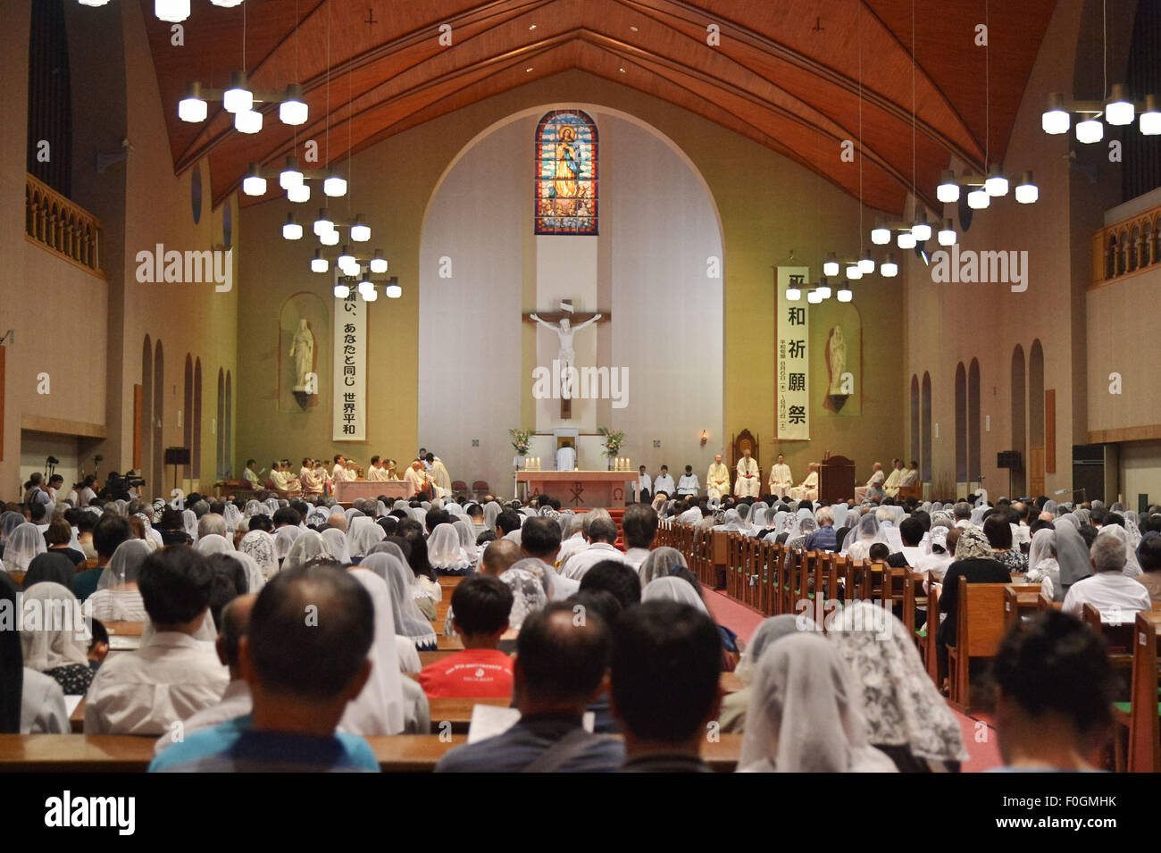 Worshippers pray during mass hi-res stock photography and images - Alamy
