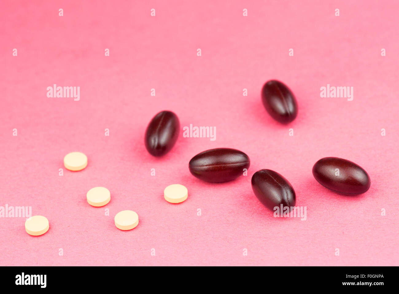 Statin tablets and Coenzyme Q10 softgel capsules Stock Photo - Alamy