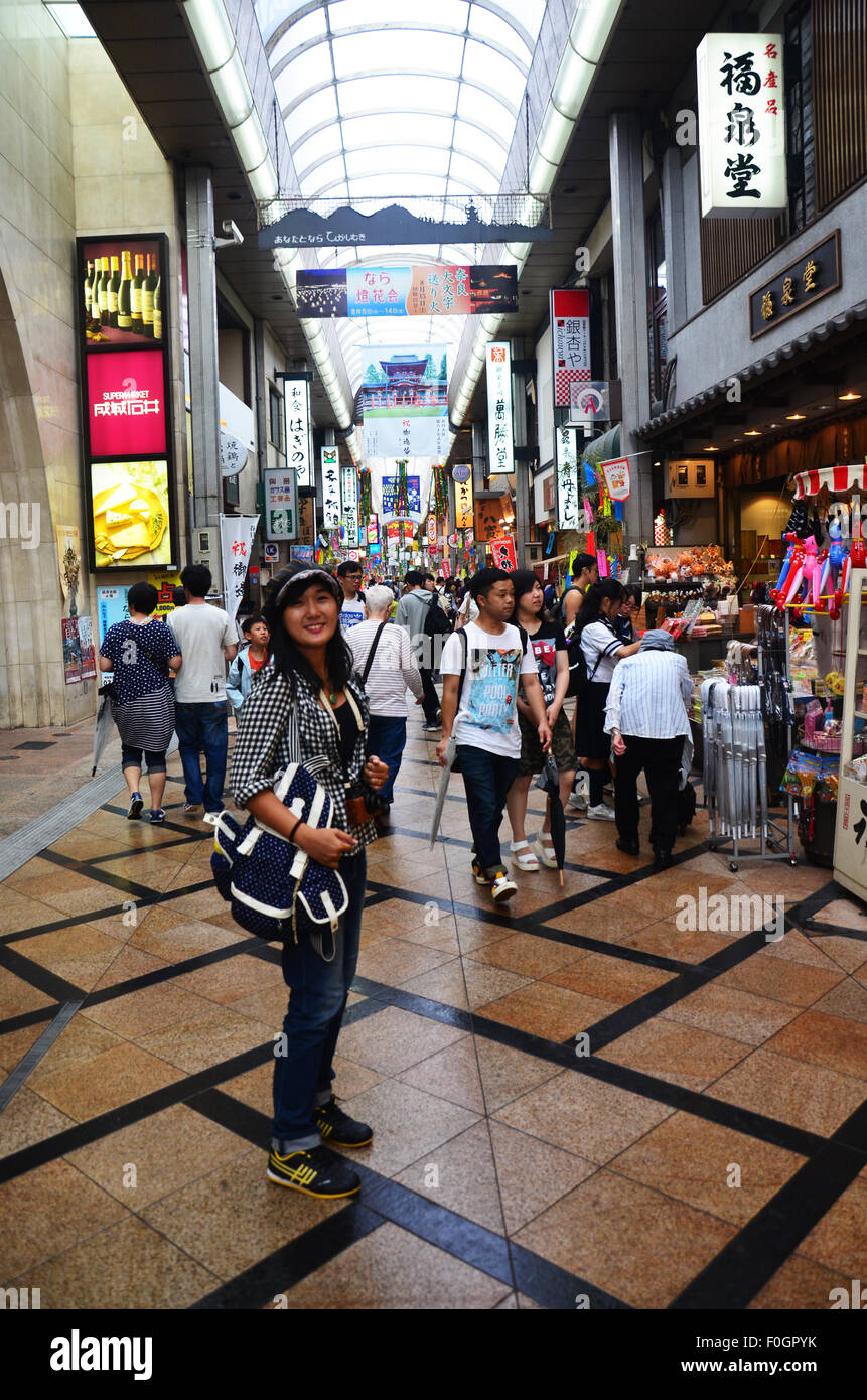 Thai woman travel and shopping at Higashimuki Shopping Street on July 7 ...
