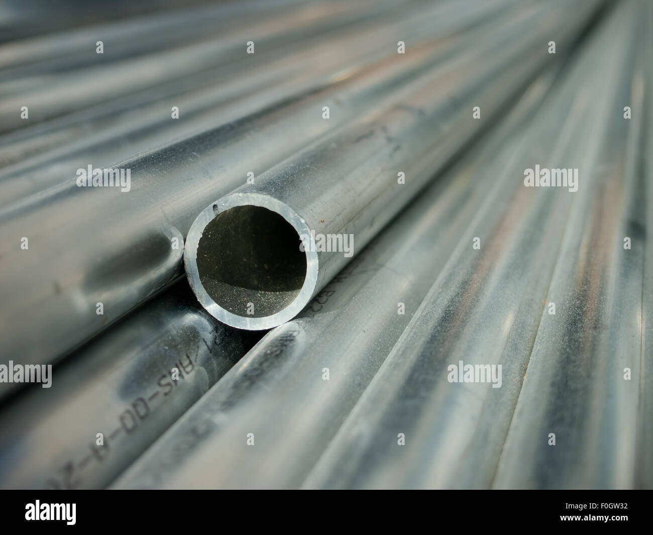 Stack of many pipes at the construction site Stock Photo - Alamy