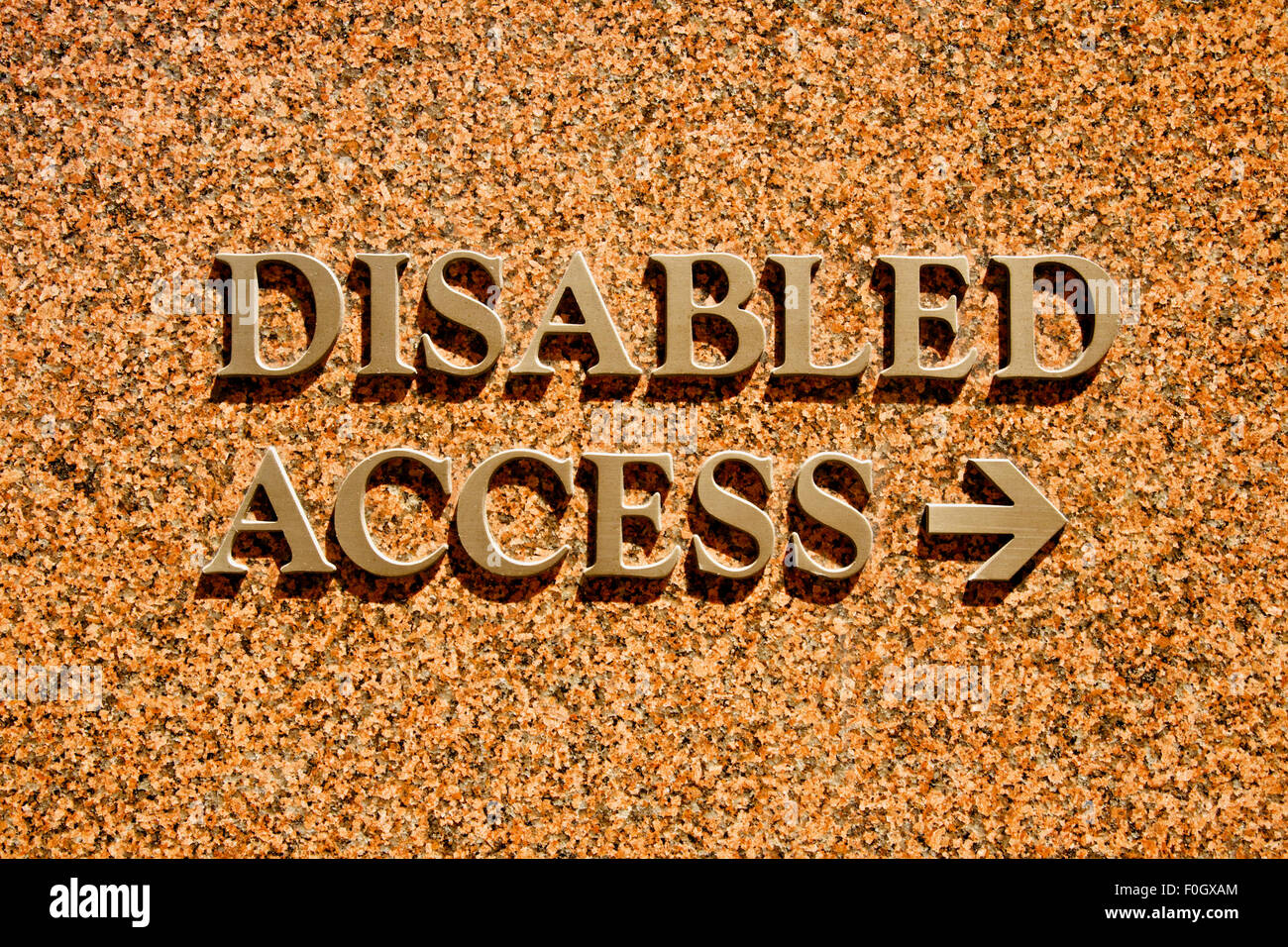 Disabled Access Sign on a Marble Wall Stock Photo - Alamy