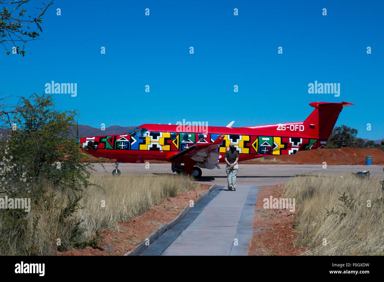 Guide waiting for arriving passengers at Tswalu Kalahari Reserve's ...
