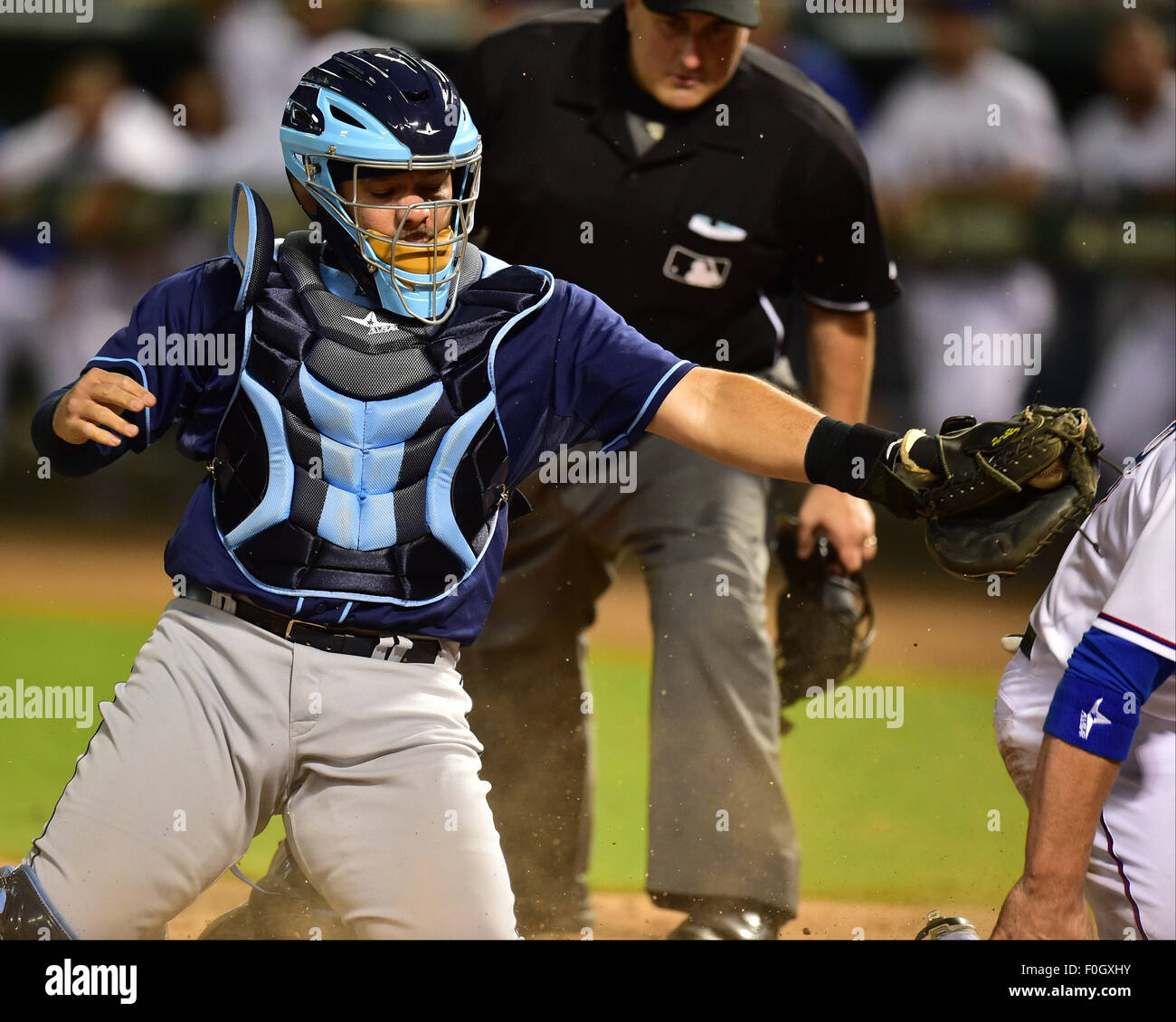 AUG 15, 2015: .Texas Rangers catcher Chris Gimenez (38) slides at home ...