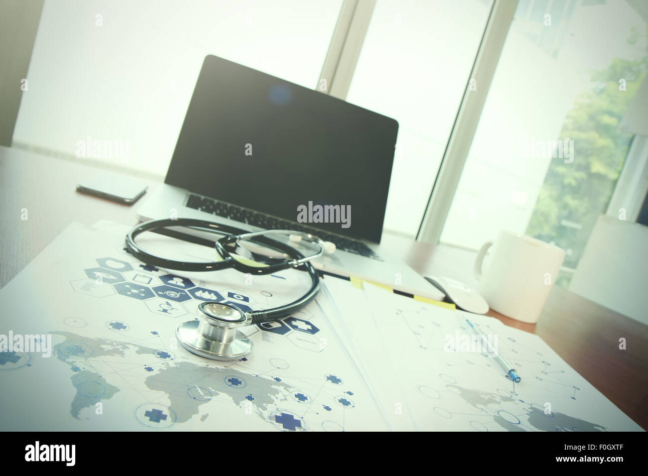 Doctor workspace with laptop computer in medical workspace office and ...