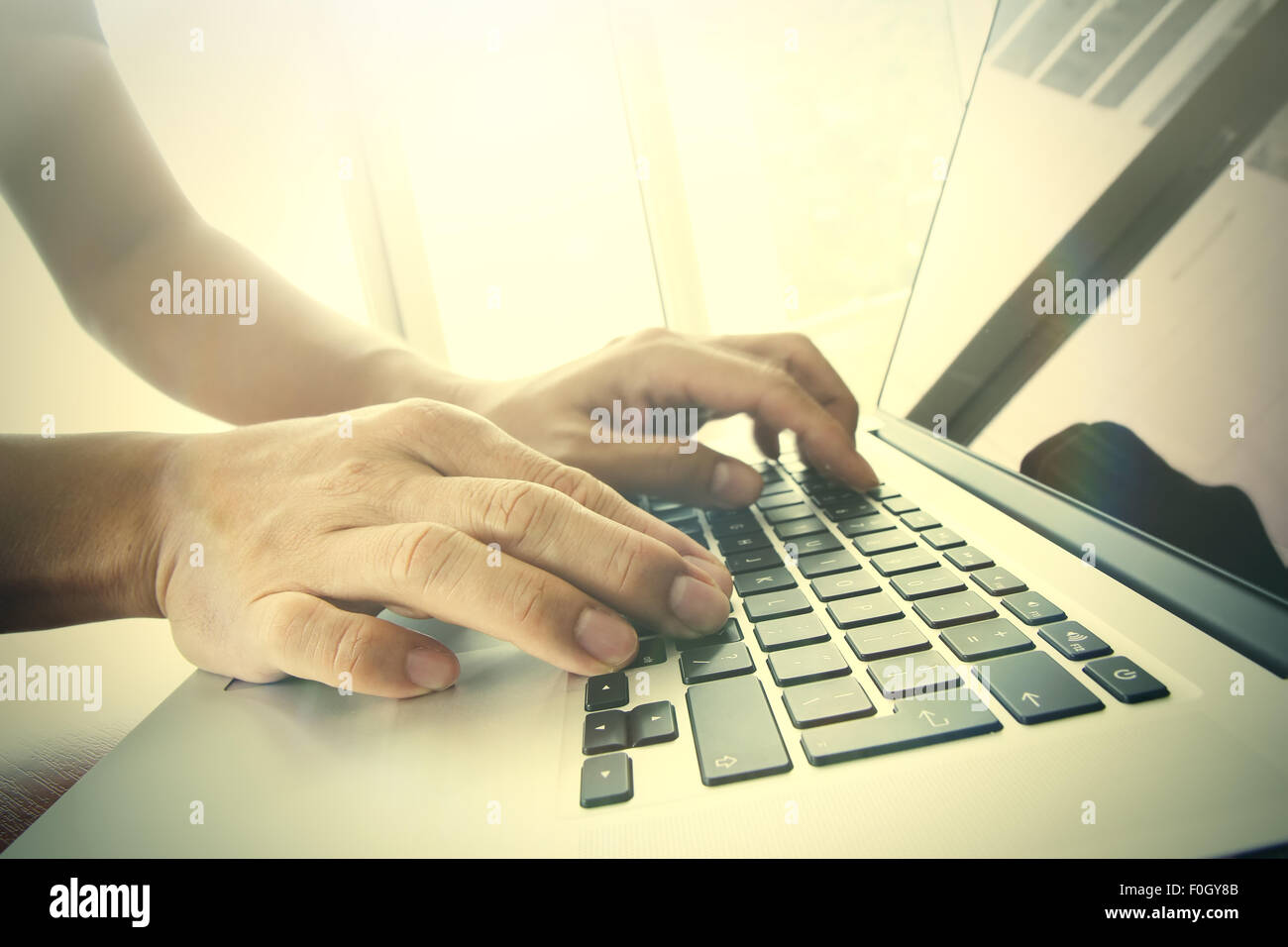 Close up of business man hand working on blank screen laptop computer ...