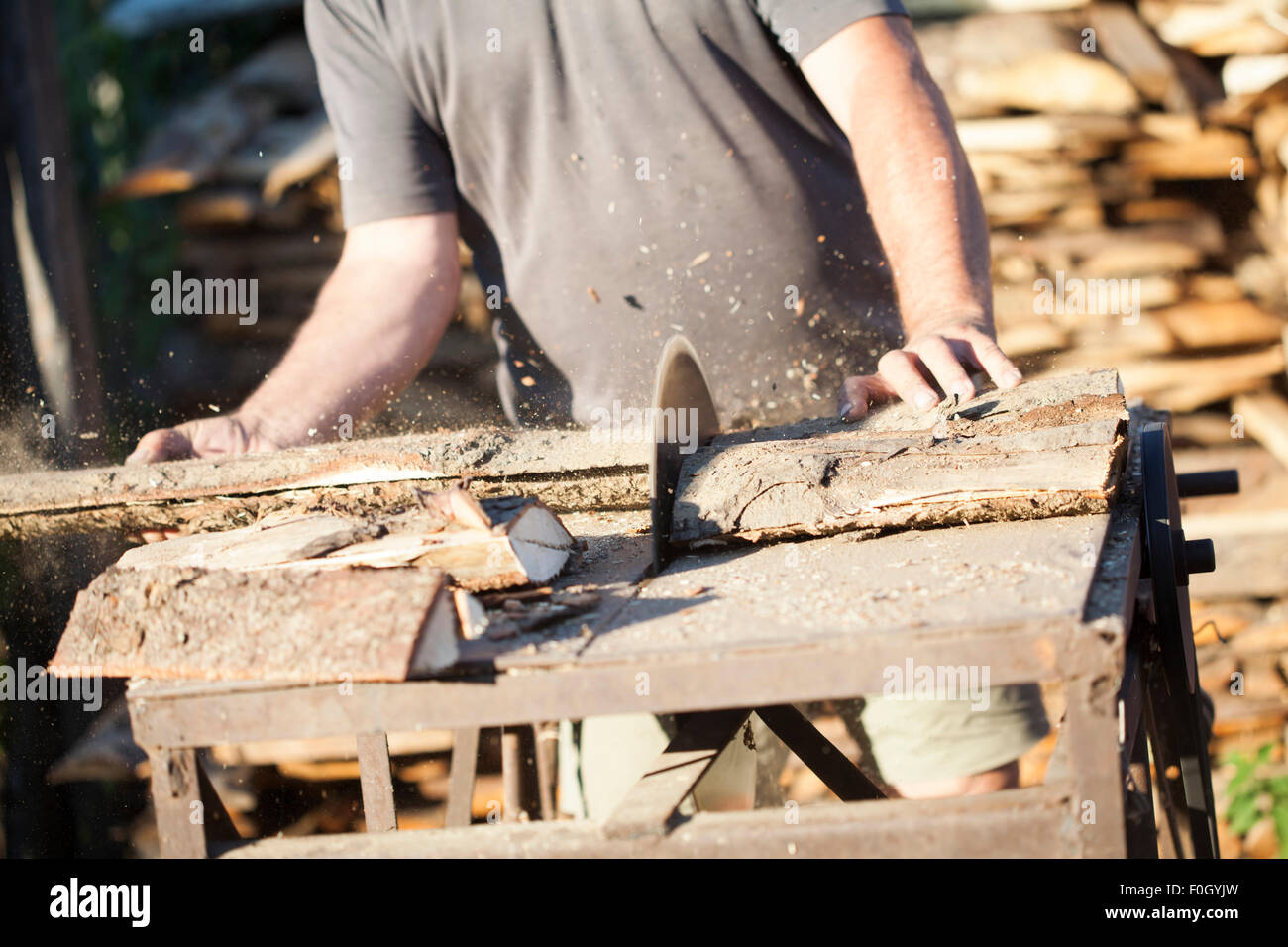 Lumberman working on circular saw Stock Photo - Alamy
