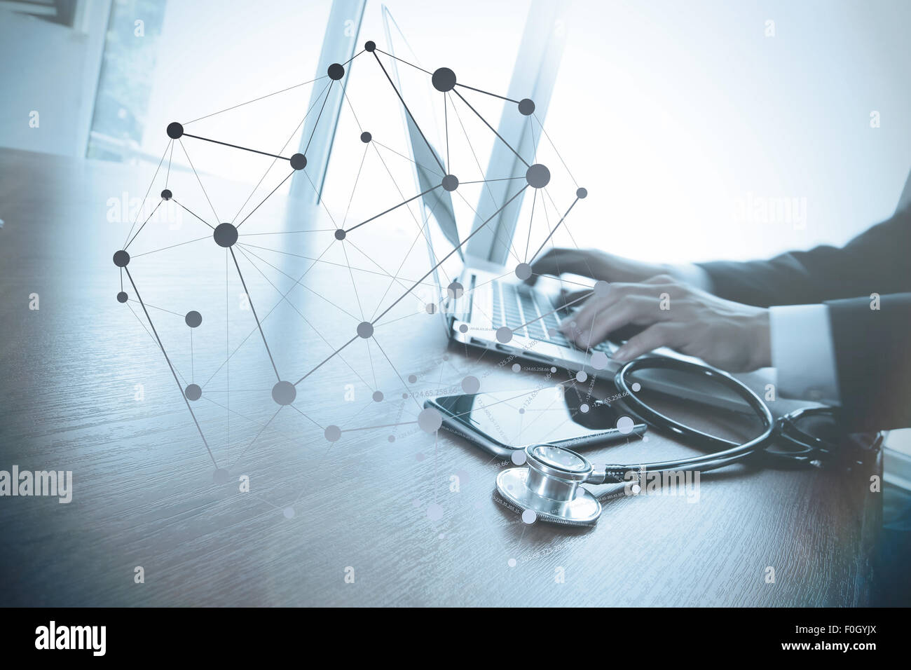 Doctor working with laptop computer in medical workspace office and ...