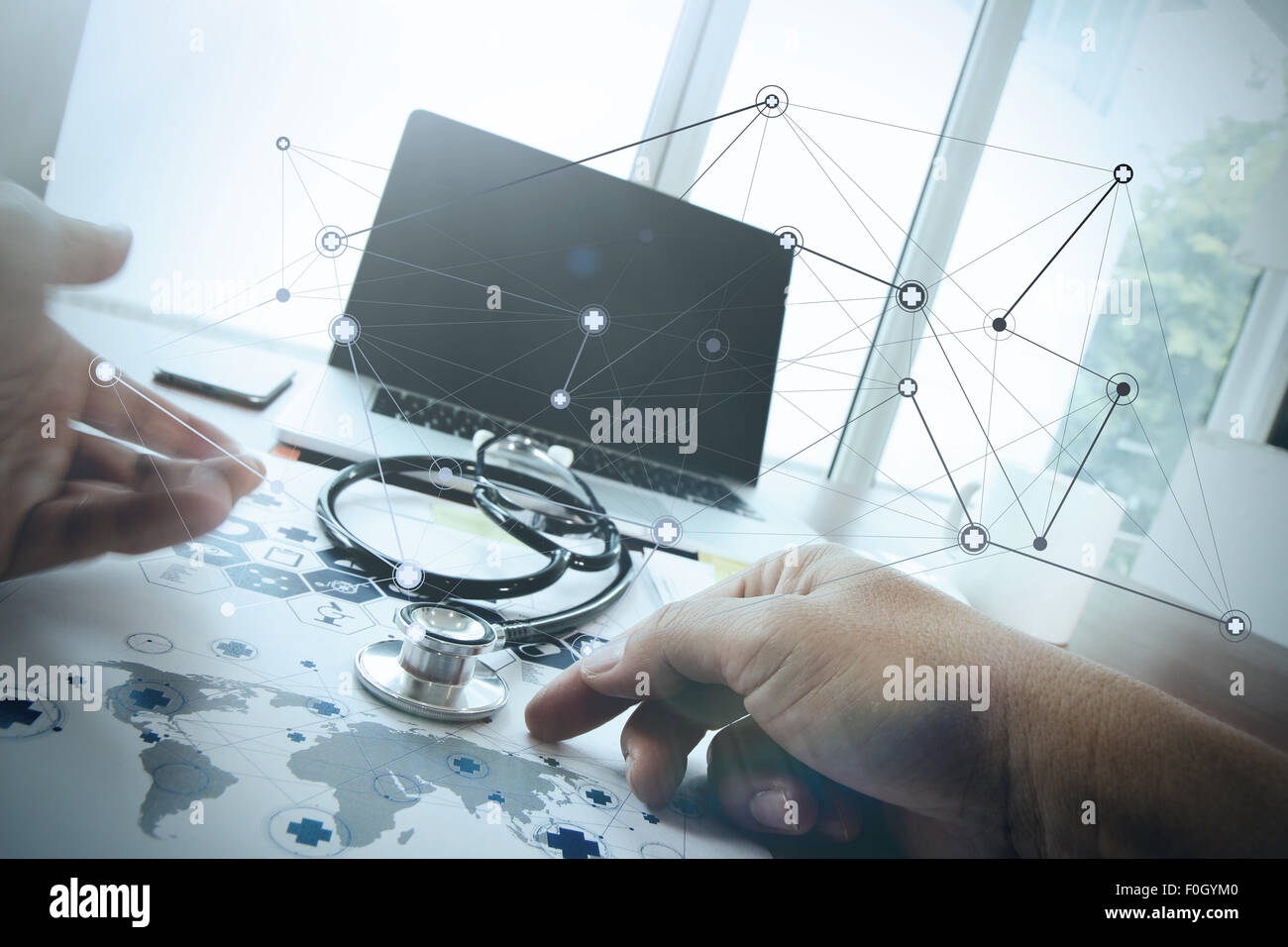 Doctor working with laptop computer in medical workspace office and ...
