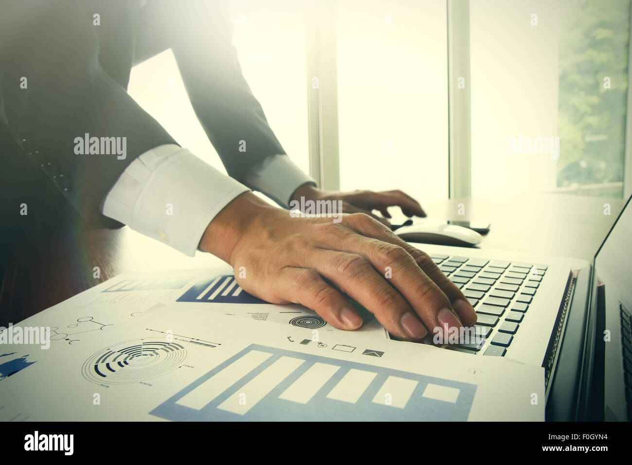 Close up of business man hand working on blank screen laptop computer ...