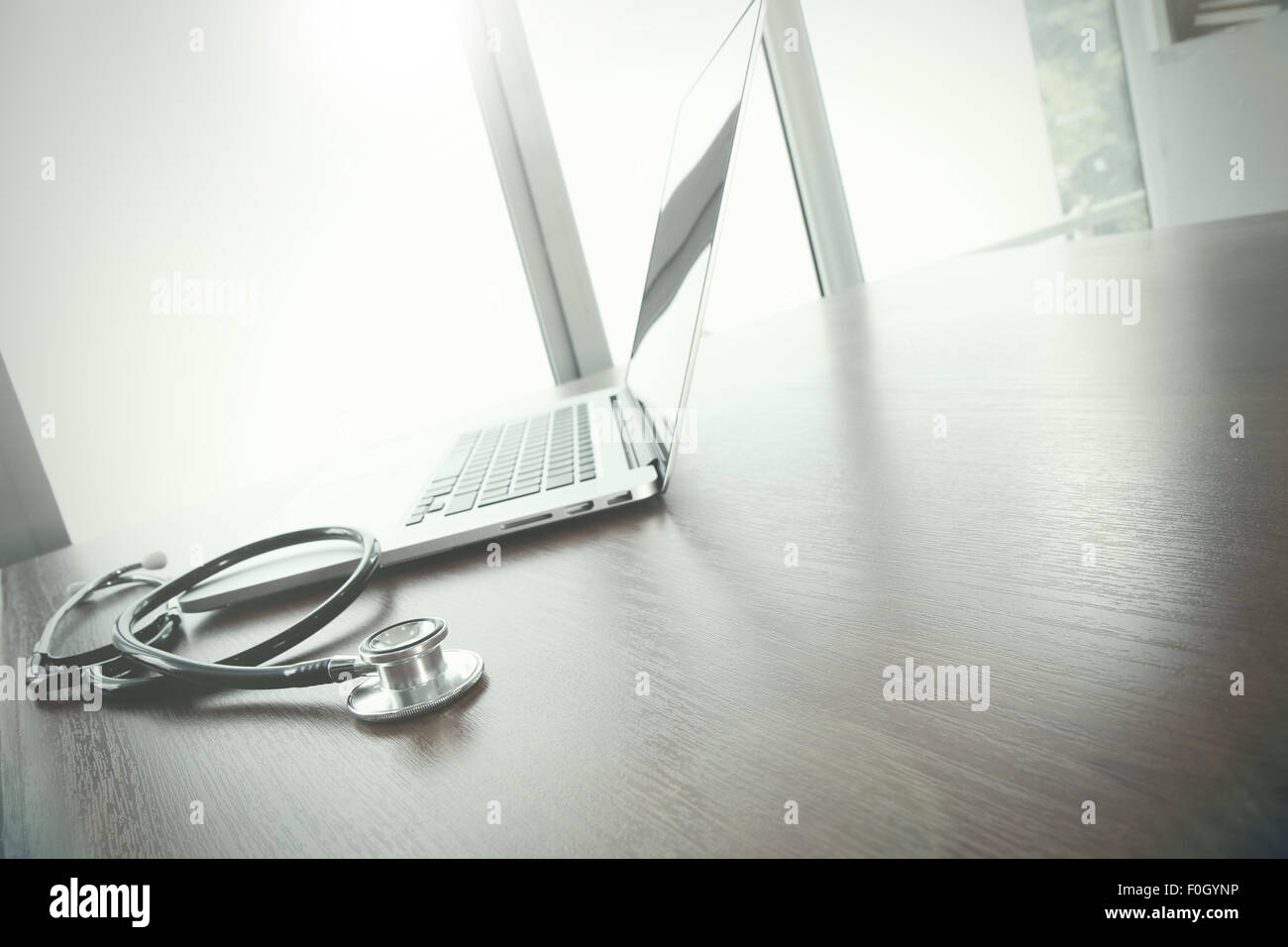 Doctor workspace with laptop computer in medical workspace office and ...
