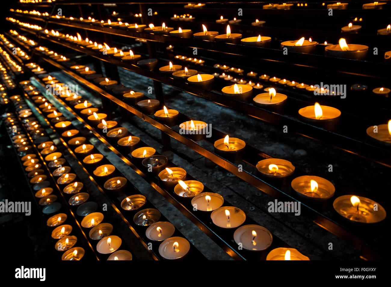 flaming memorial candles in church Stock Photo - Alamy