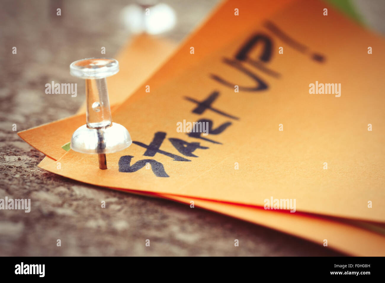 close up of pin and hand drawn business strategy graph chart on sticky ...