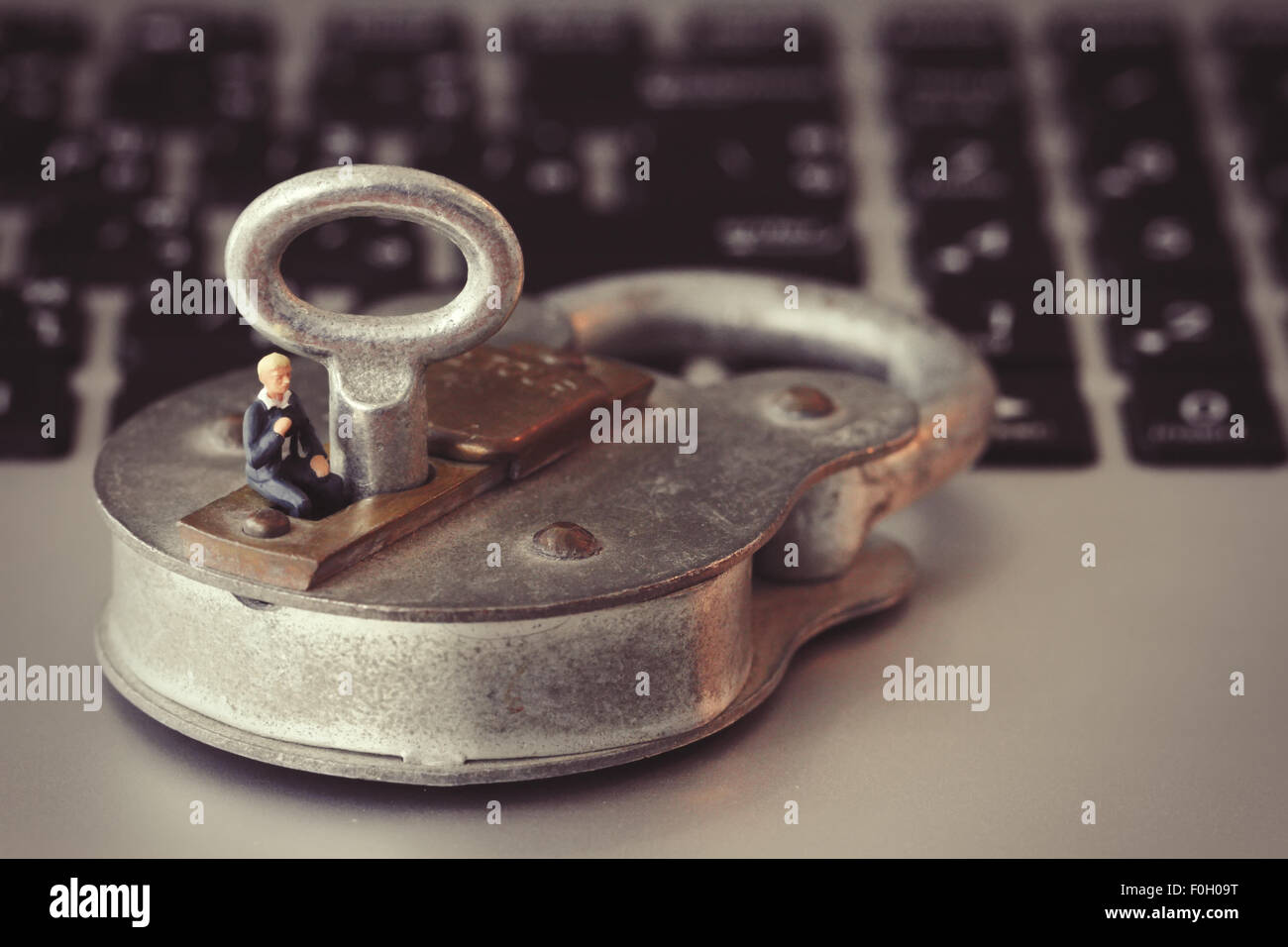 Internet security concept-old padlock and key on laptop computer ...