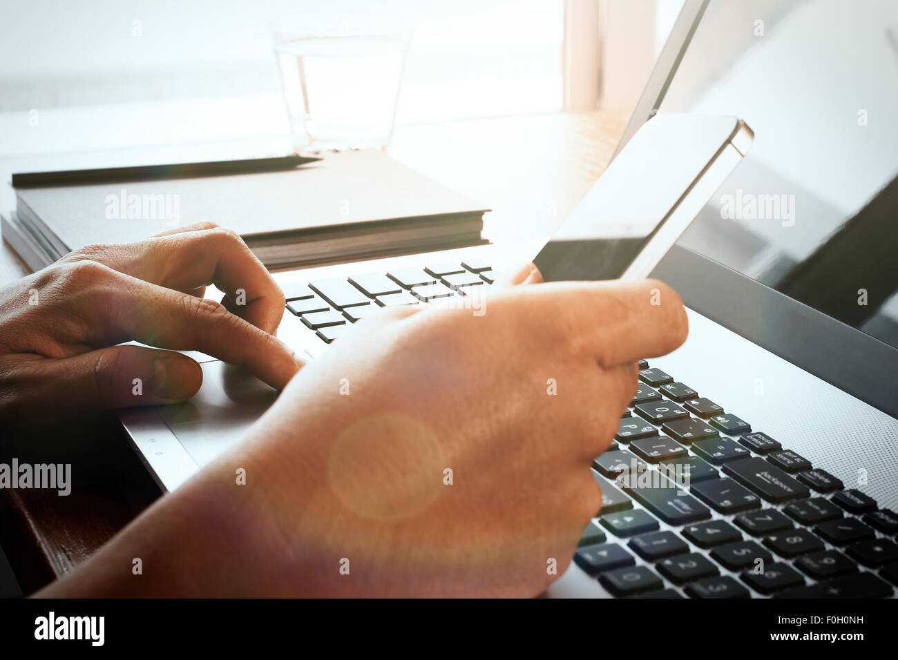 Close up of business man hand working on blank screen laptop computer ...