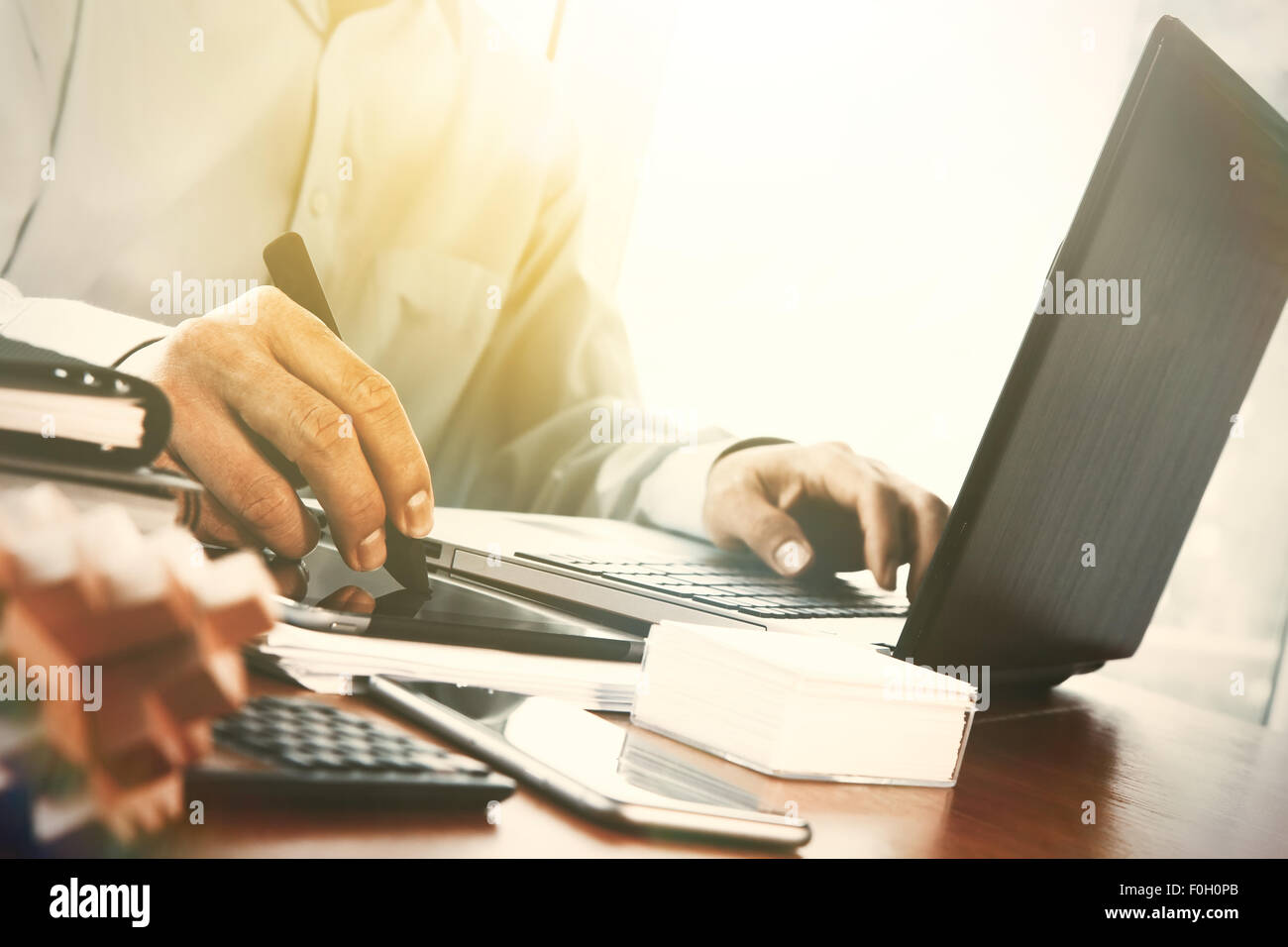 Young creative designer man working with stylus pen and digital tablet ...