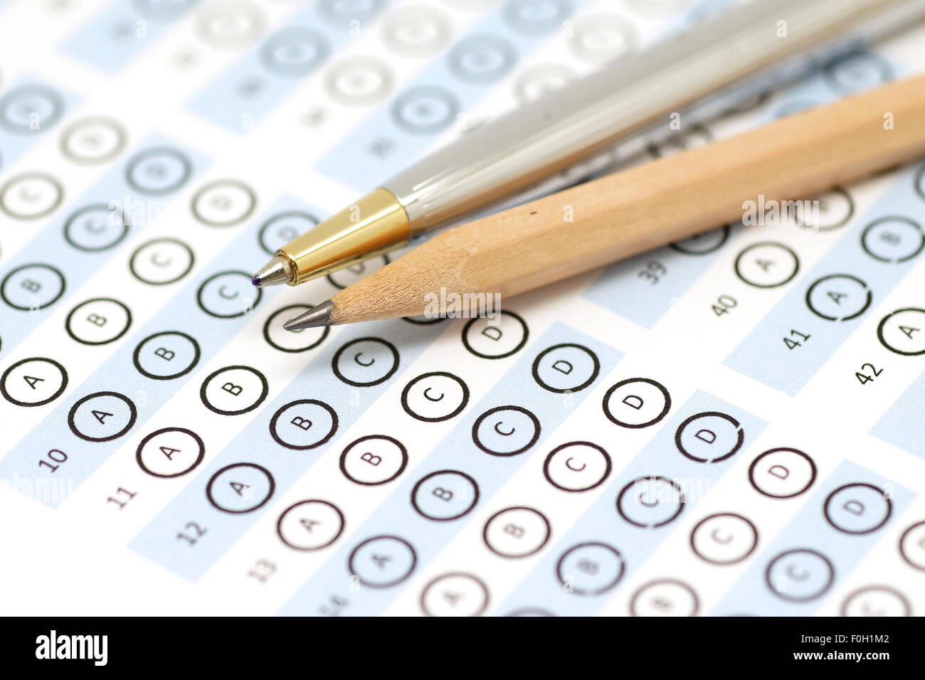 answer sheet test score with pencil and pen Stock Photo - Alamy